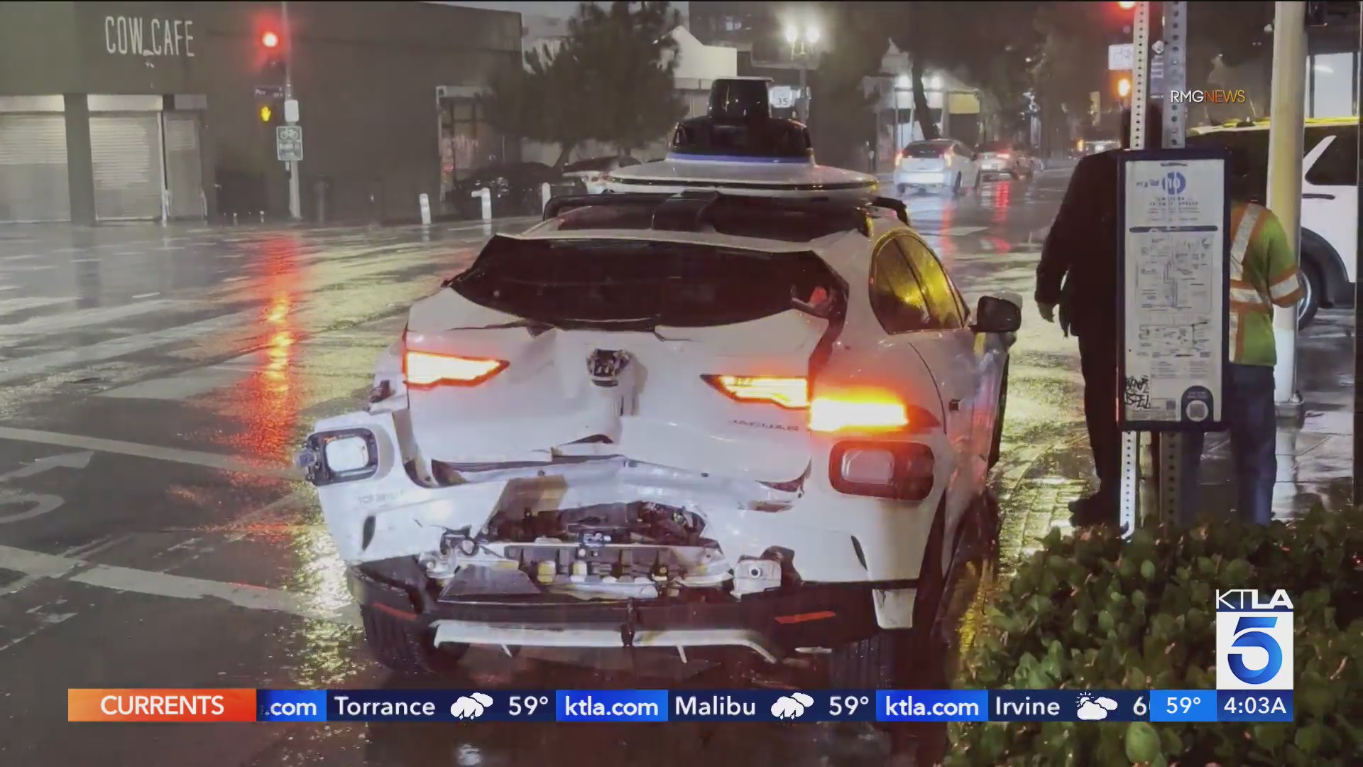 Driverless taxi filled with passengers rear-ended by hit-and-run driver ...