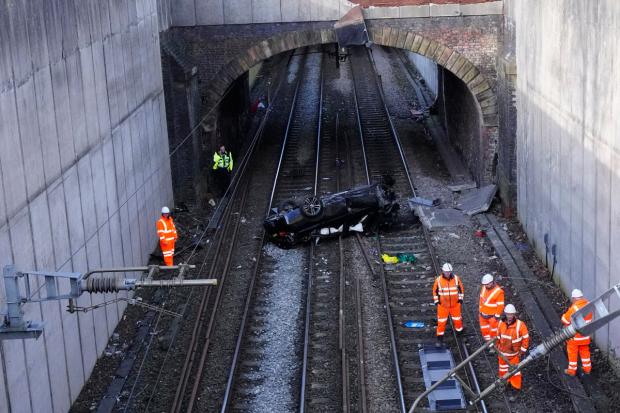 Man taken to hospital as major train line blocked after car crashed on ...
