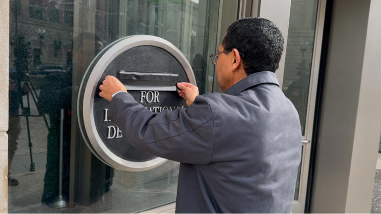 USAID signs removed from DC headquarters as thousands of workers placed ...