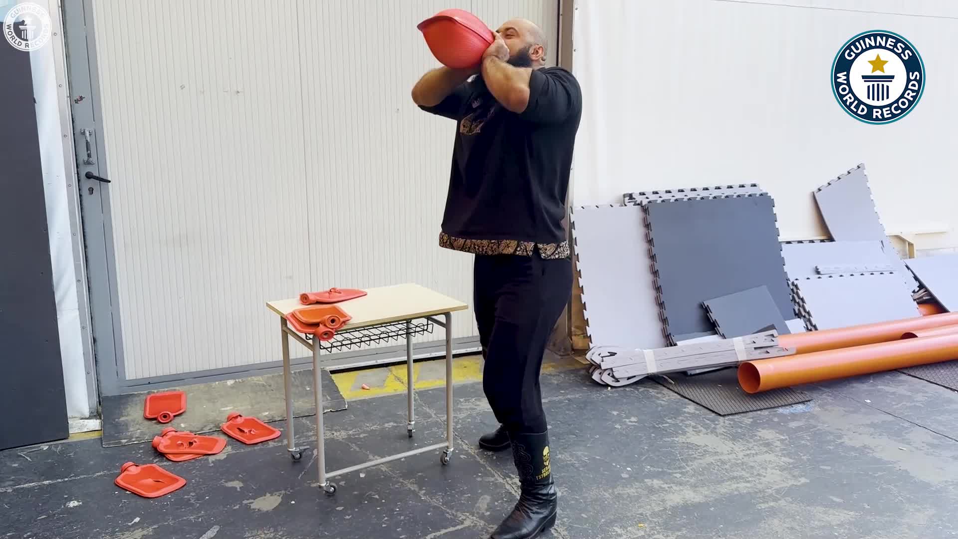 Sergey smashes Guinness World Records title for bursting hot water bottles