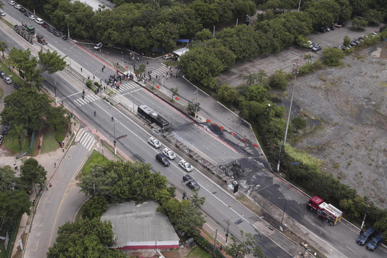 A small plane slams into a Brazilian street and kills 2 people on board