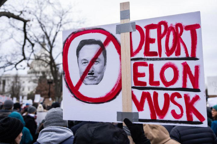 Angry protesters with scathing signs take on Donald Trump, Elon Musk in ...