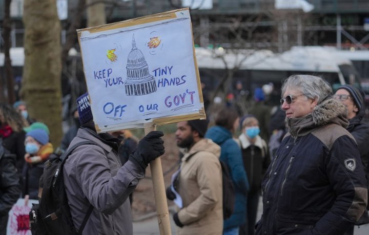 Angry protesters with scathing signs take on Donald Trump, Elon Musk in ...