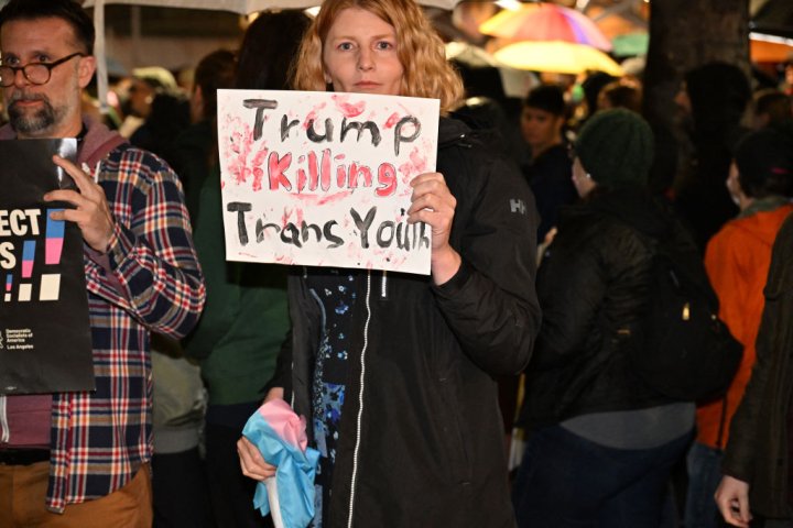 Angry protesters with scathing signs take on Donald Trump, Elon Musk in ...