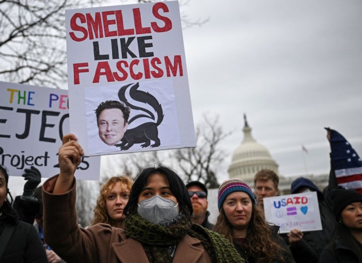 Angry protesters with scathing signs take on Donald Trump, Elon Musk in ...