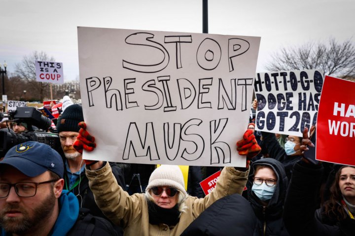 Angry protesters with scathing signs take on Donald Trump, Elon Musk in ...