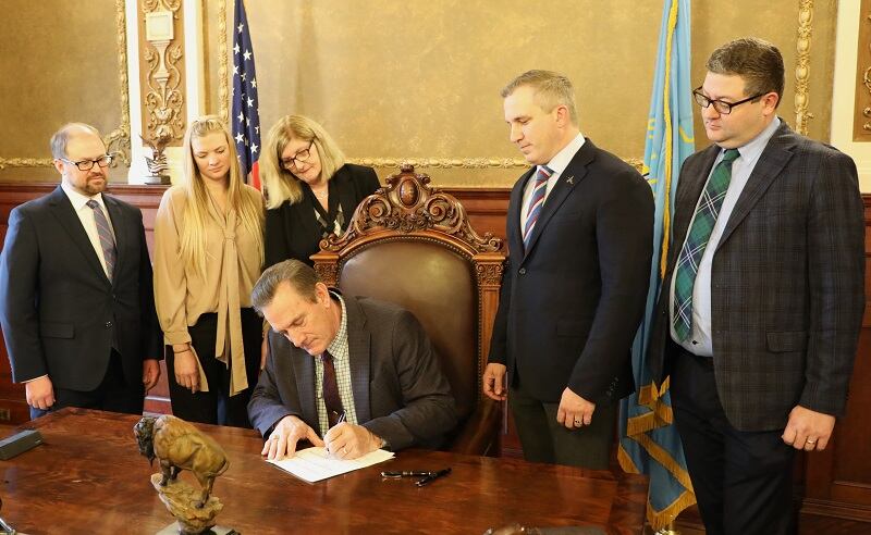 Larry Rhoden signs first bill as Governor