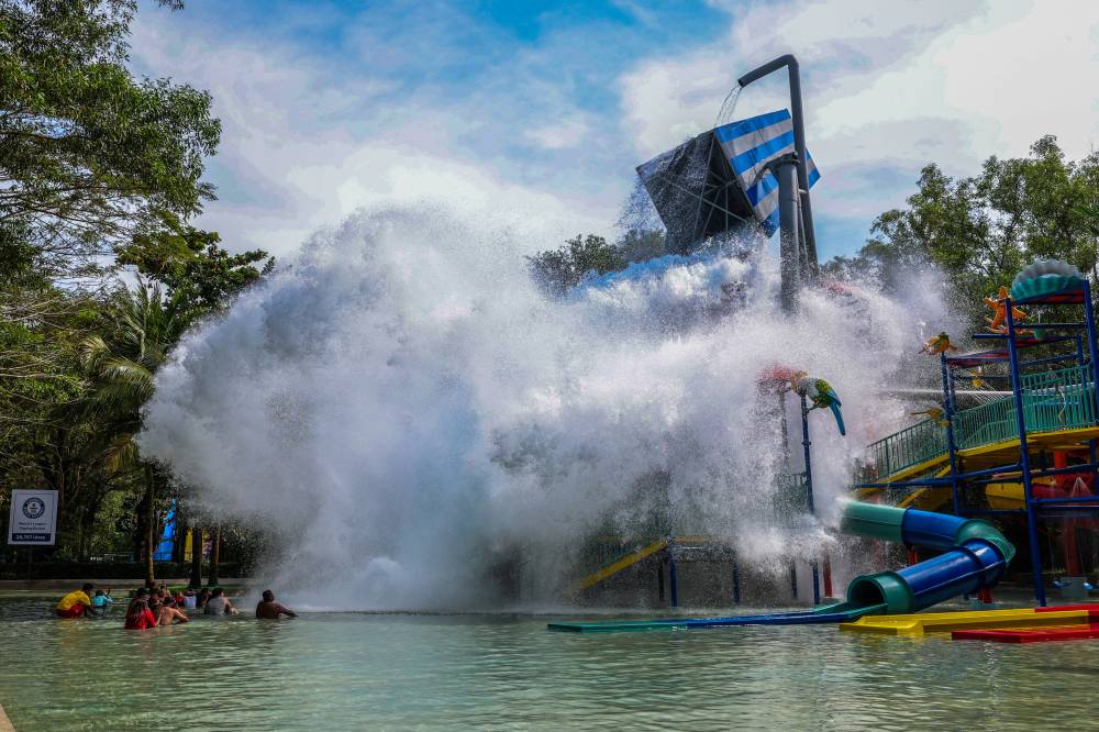 Giant bucket, epic slide—Escape Penang splashes into the record books!