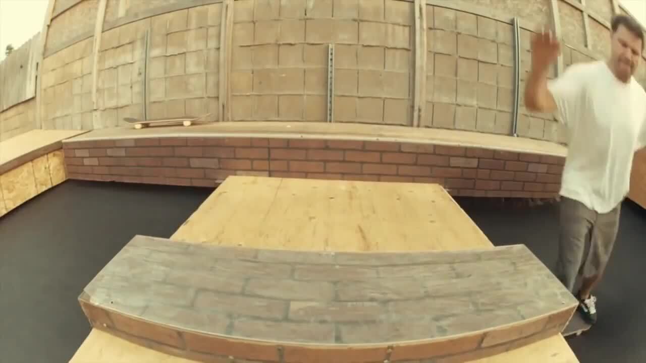 Guy Skateboards while on Trampoline