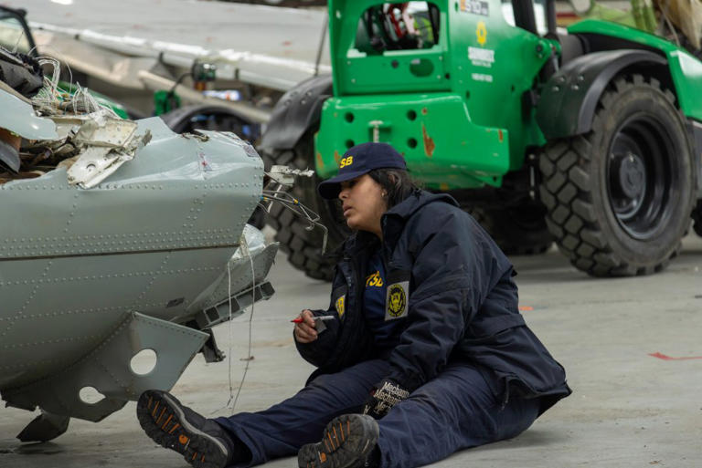 PHOTOS: Investigators examine, document aircraft wreckage following ...