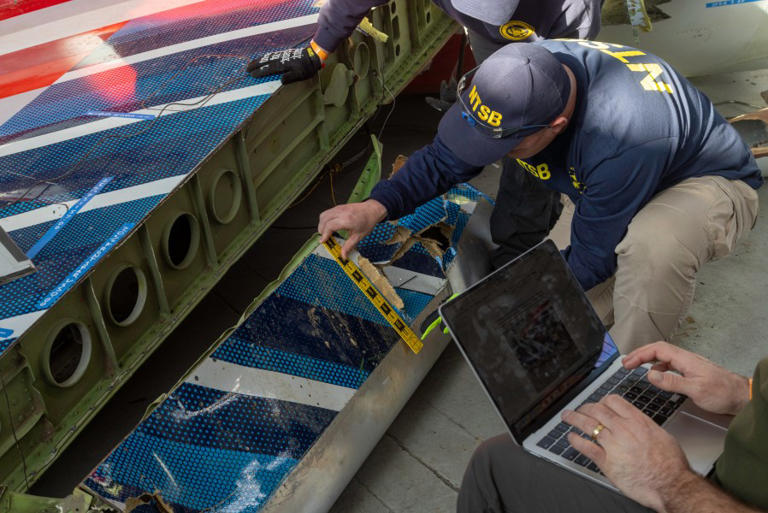 PHOTOS: Investigators examine, document aircraft wreckage following ...