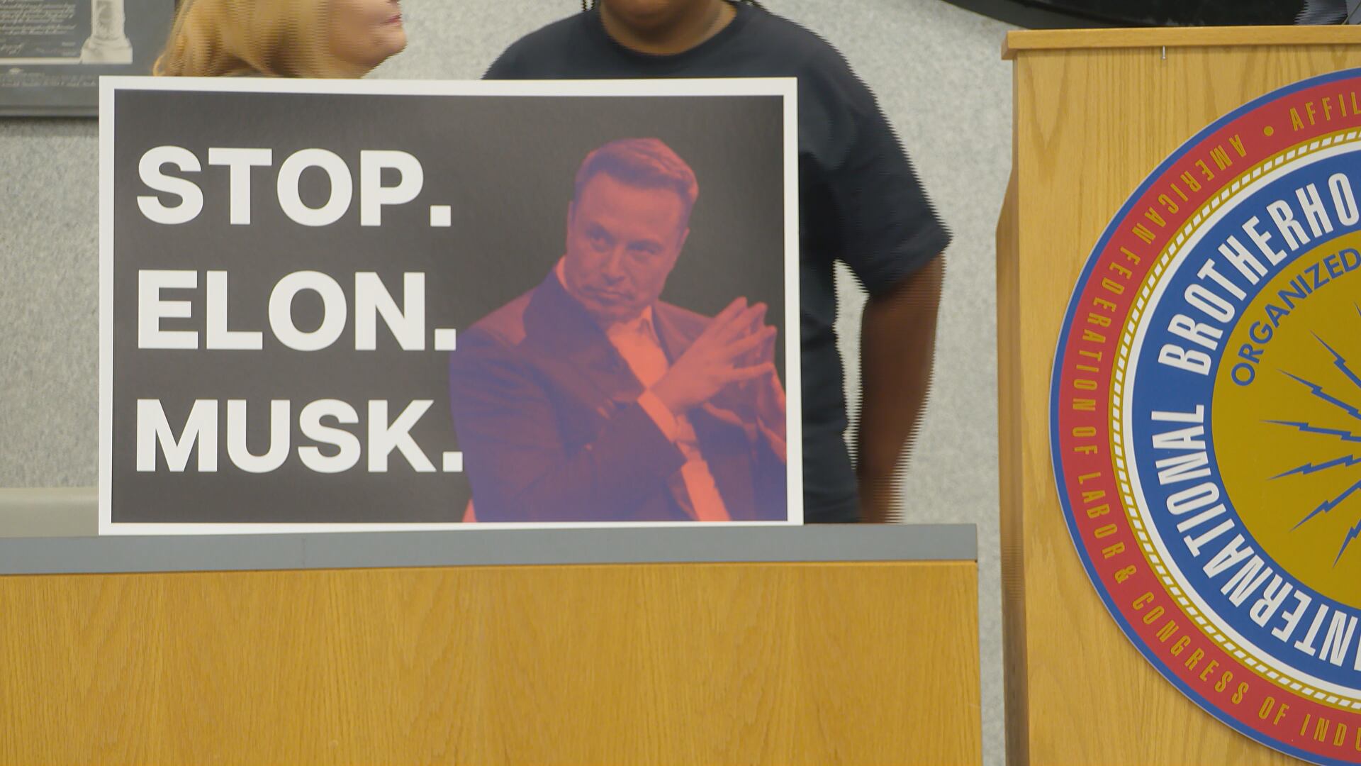 Hundreds gather for ‘Stop Elon’ rally