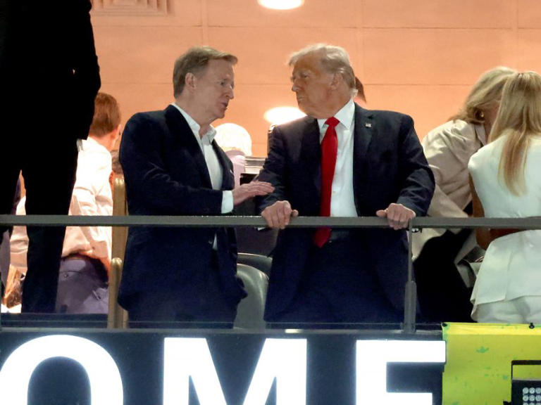 Who is President Trump sitting with at the Super Bowl?