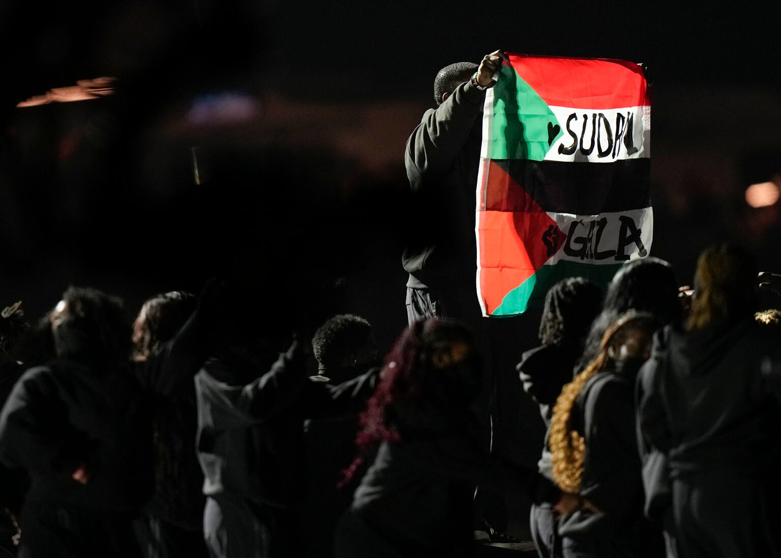 Super Bowl halftime performer detained after unfurling Sudan-Palestine flag