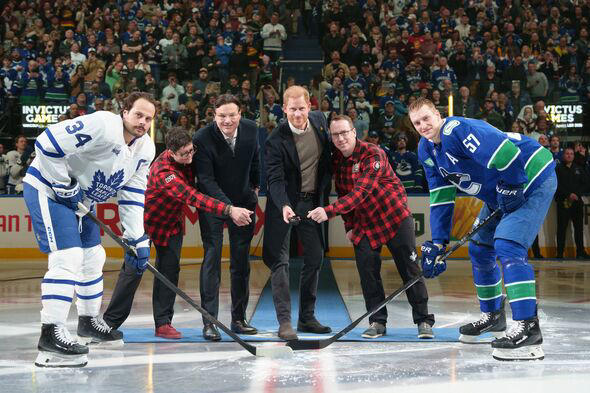 Prince Harry and Meghan Markle make surprise appearance at NHL ice ...