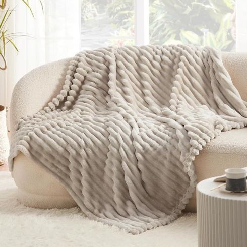 Cozy up With Style: 10 Throw Blankets We Love