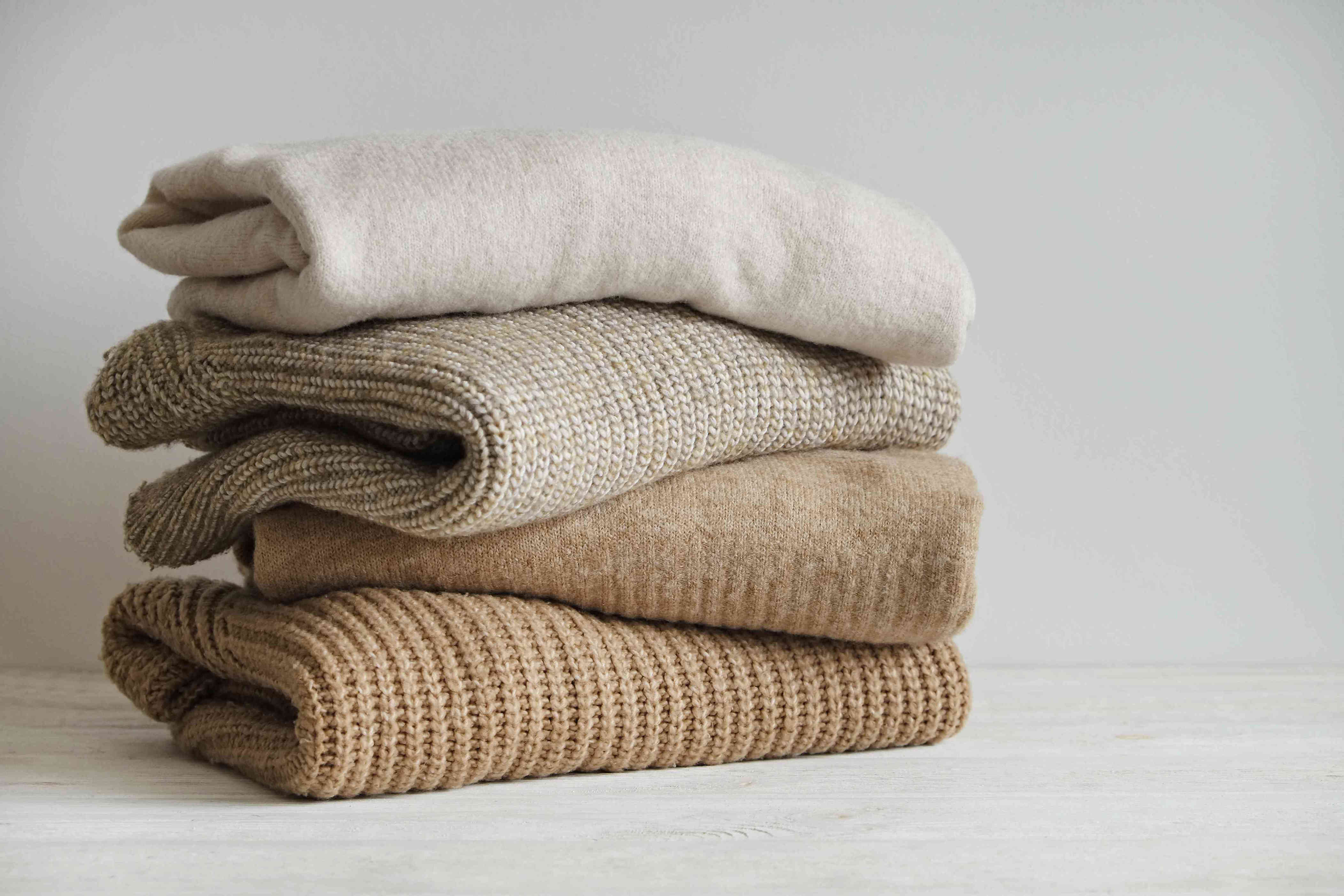 Hanging Sweaters Can Stretch Them Out—Here’s What to Do Instead