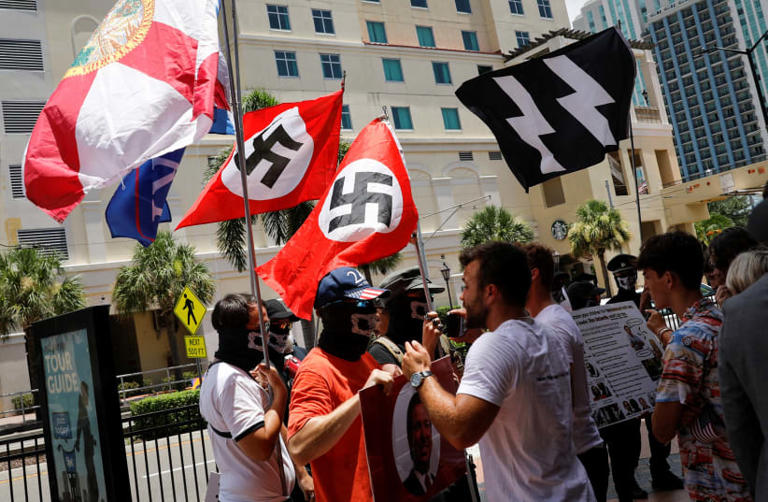 Two charged in Australia for displaying Nazi flags as laws toughened