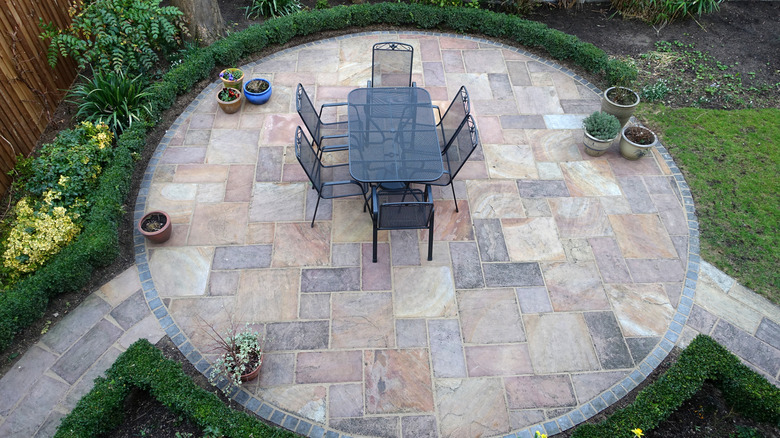 How To Lay Pavers For A Rounded Patio In Your Backyard