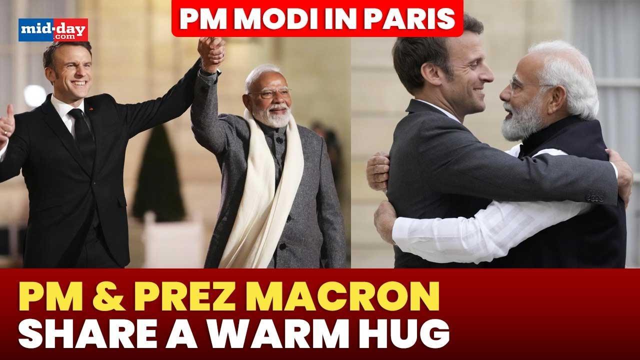 PM Modi in Paris: French Prez Macron greets PM with a heartfelt hug ...