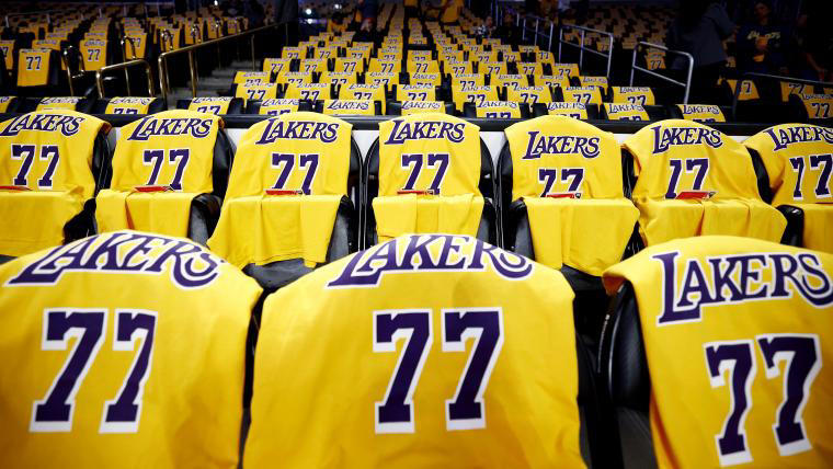 Luka Doncic T-shirts, explained: Lakers give away yellow No. 77 shirts ...