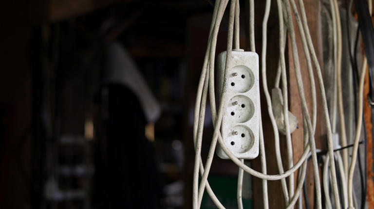 Keep Extension Cords Tucked Out Of Sight With A Genius Storage Solution
