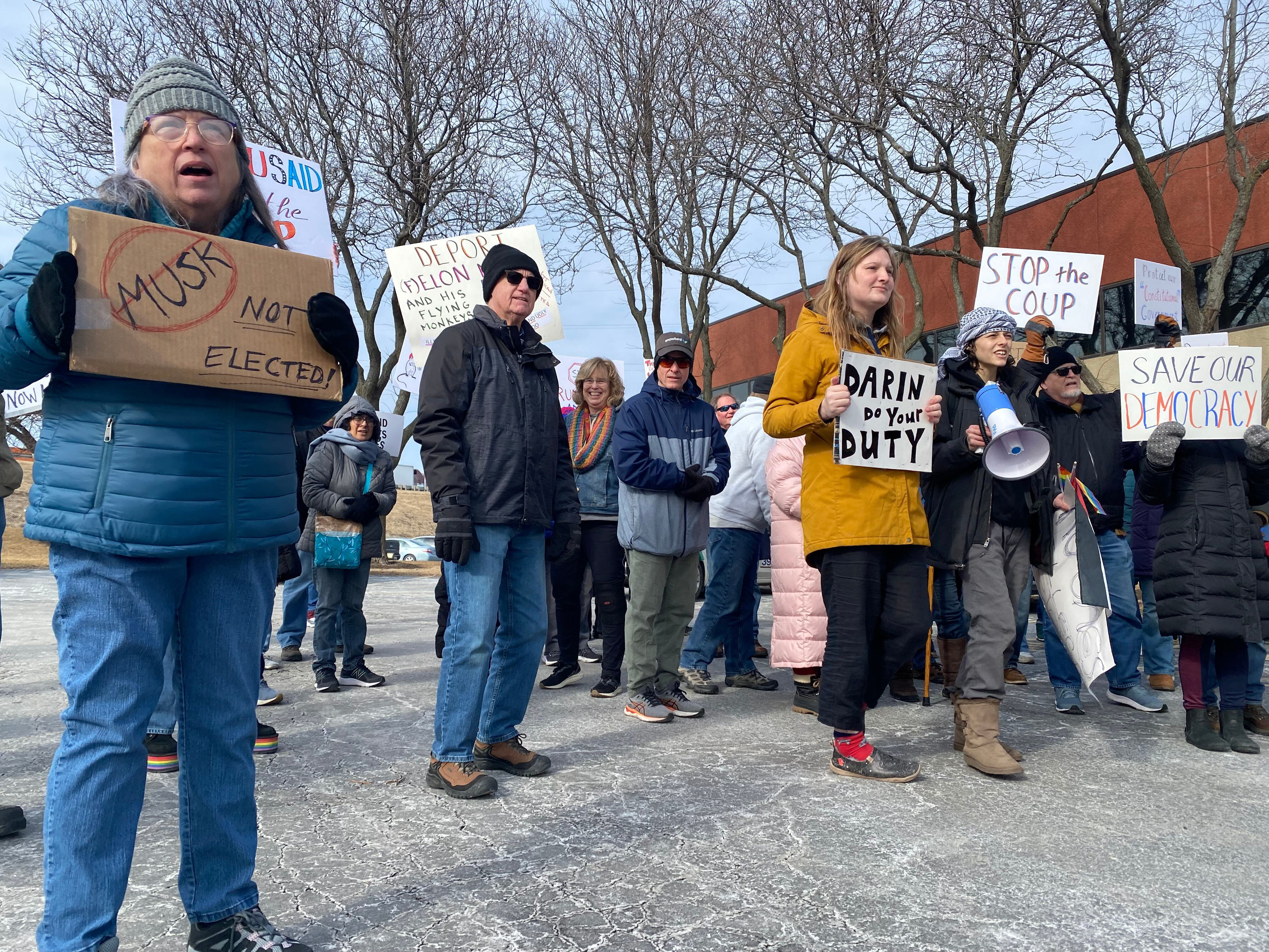 Protestors condemn Trump, Musk ‘coup’ in protest at Rep. Darin LaHood’s ...