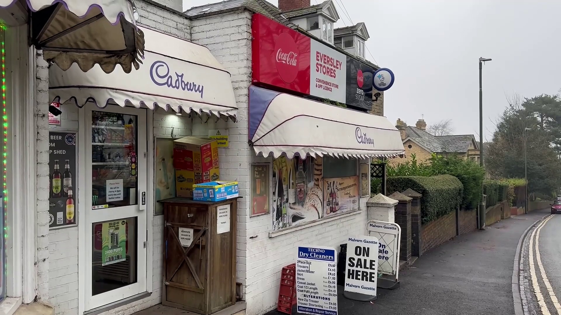 Hero shopkeeper hands over bread, butter and milk to hungry robber with ...