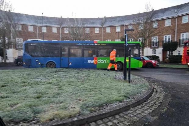 Stuck bus blocks road after trying to get past parked cars