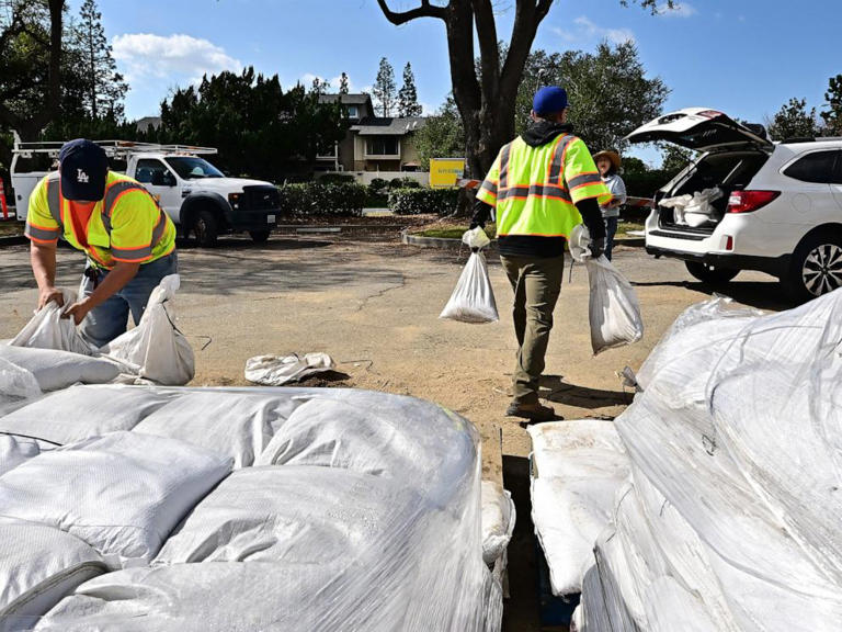 Firefighter swept into ocean in debris flow as heavy rain pounds LA