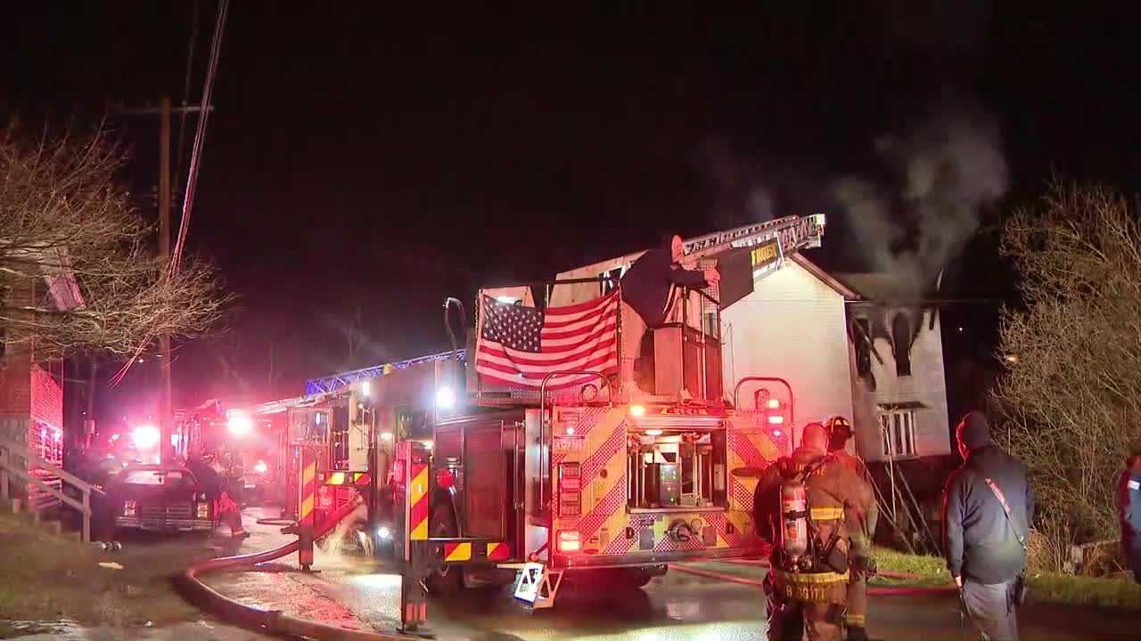 Firefighters work to douse flames after fire erupts inside Pittsburgh home