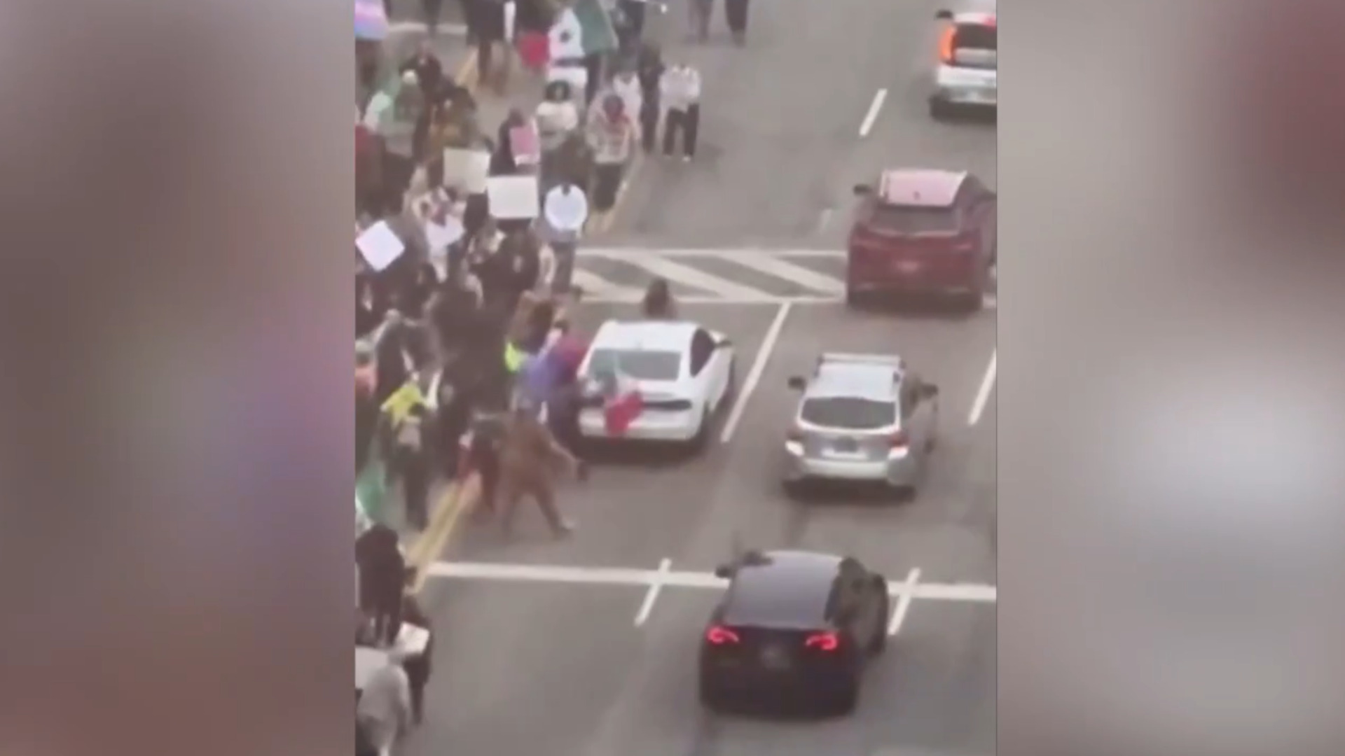 Anti-ICE protester struck by car after blocking traffic