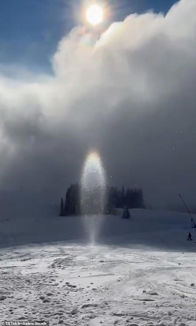 Skier films 'magic portal' of light as natural phenomenon forms