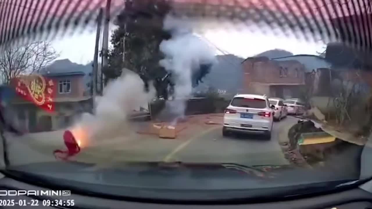 Chinese New Year firecrackers set off on road explode next to wedding car