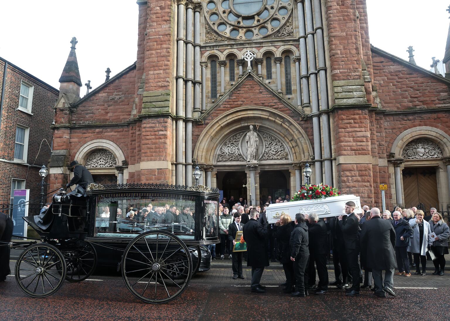 Mourners say farewell to boxing icon at funeral of Gerry Storey Jnr