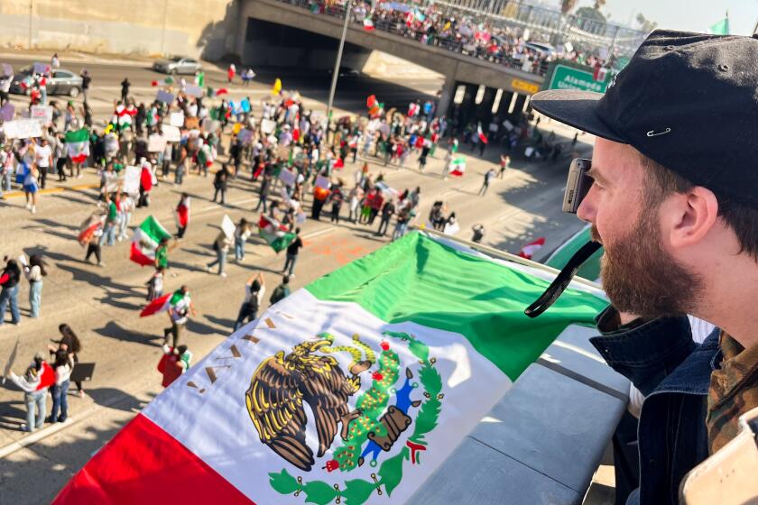 Thousands of protesters rally in downtown Los Angeles against Trump's ...