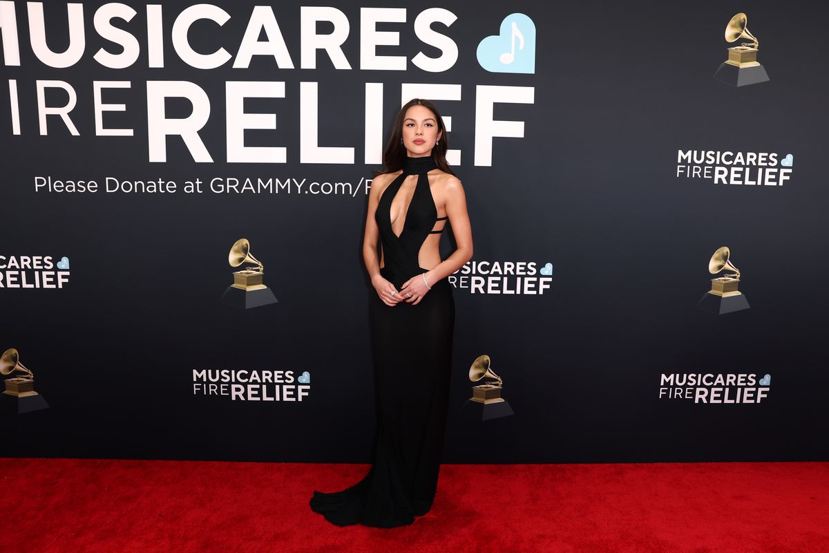 Olivia Rodrigo Wears a Plunging Halter Dress Alongside Louis Partridge ...