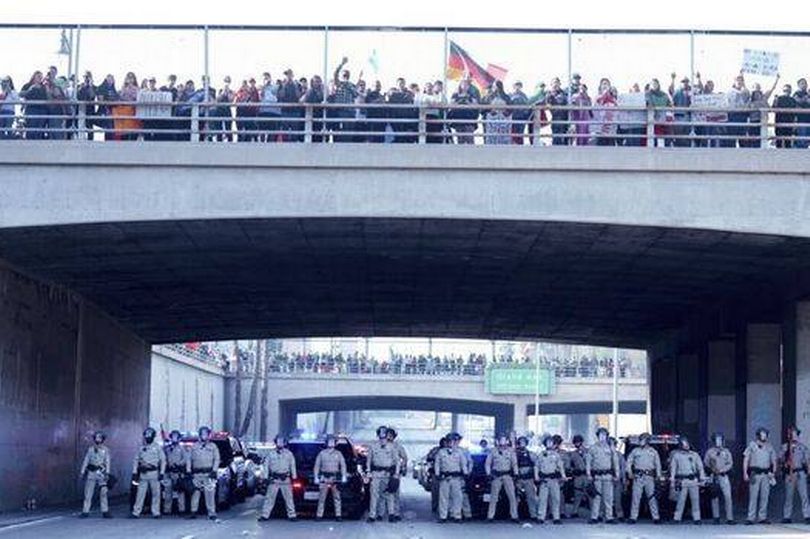 Thousands of protesters block off major freeway in Los Angeles over ...