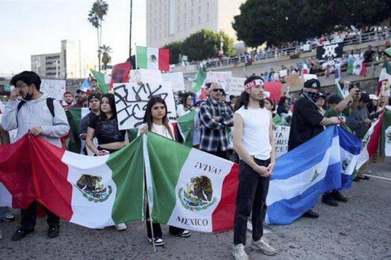 Thousands of protesters block off major freeway in Los Angeles over ...