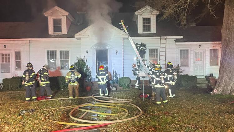 Graham firefighter rescued in late-night house fire