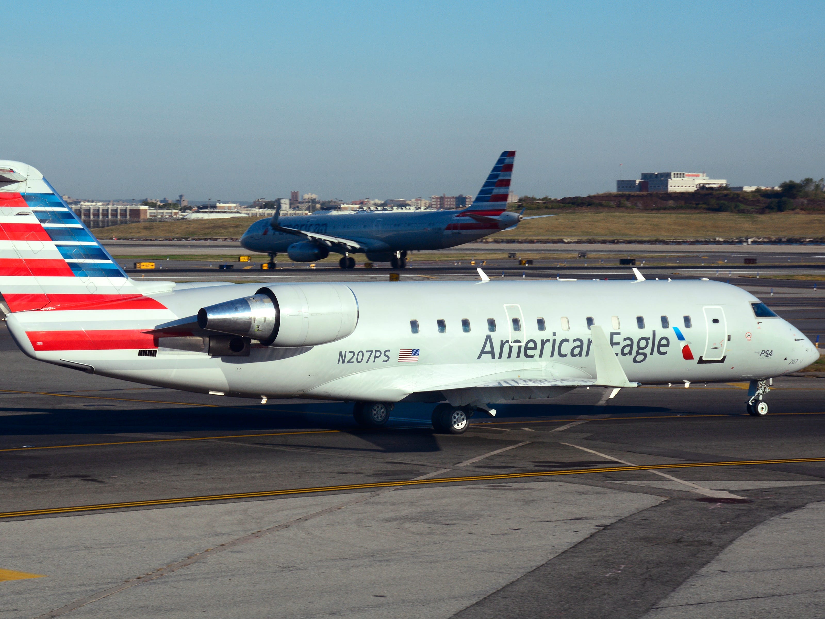 A United Airlines employee was severely injured after an American Eagle ...