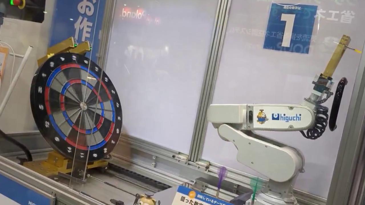 Impressive moment robot plays dart game