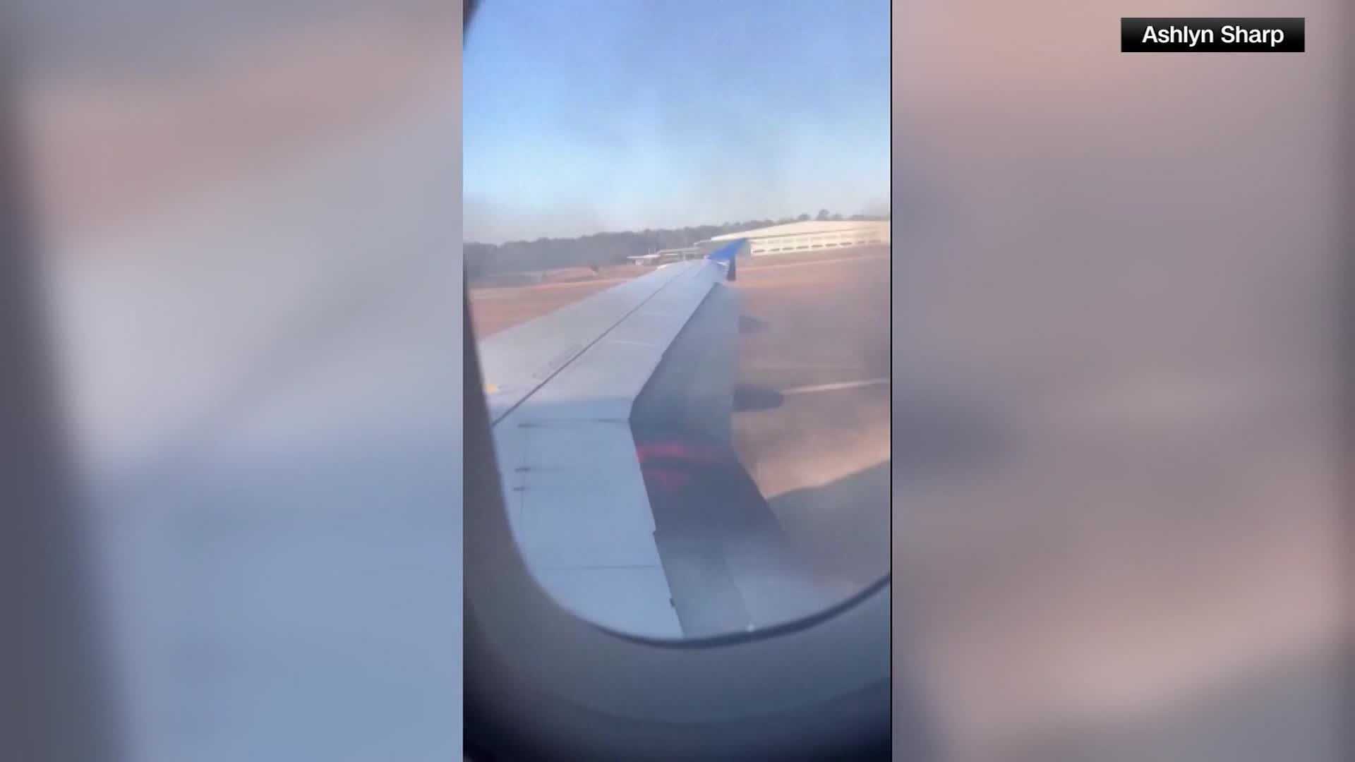 Flight evacuated after engine sparks fire on wing during takeoff in Houston