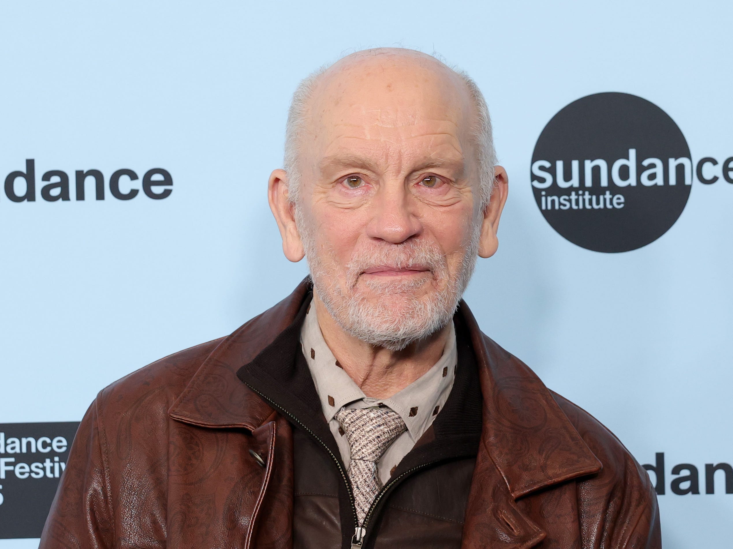 John Malkovich plays an eccentric, hip-thrusting pop star in 'Opus.' He ...