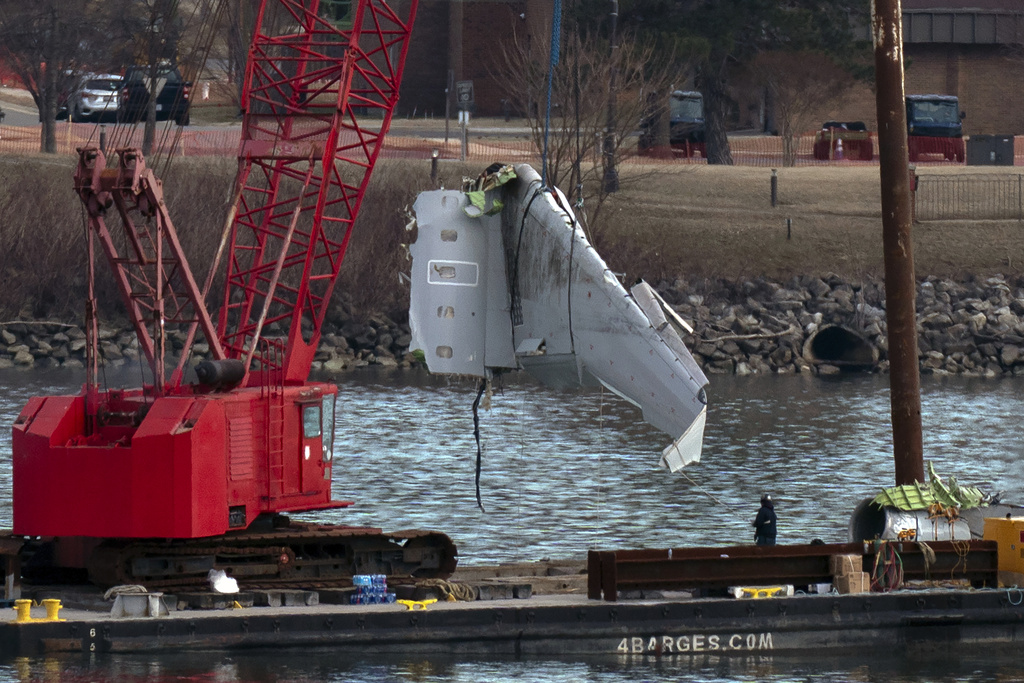 Salvage crews recover engine, large portion of jet from river after ...