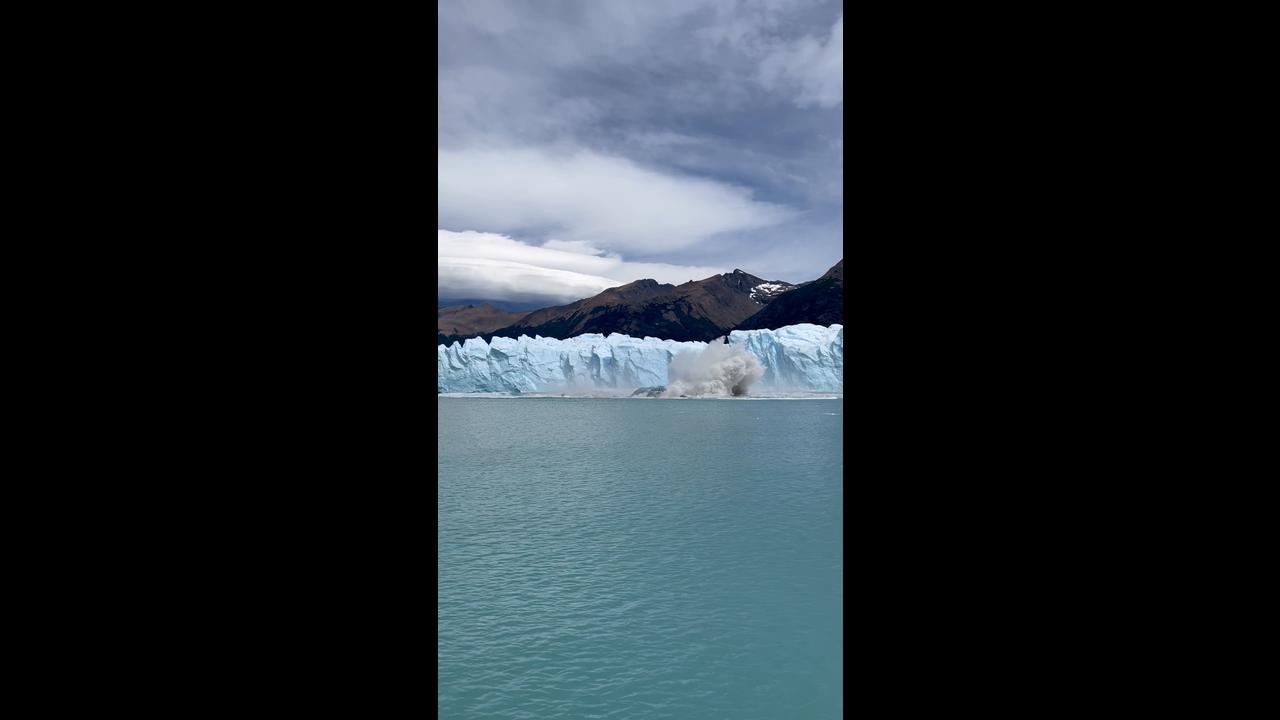 Sightseers Watch Iceberg Emerge From the Perito Moreno Glacier