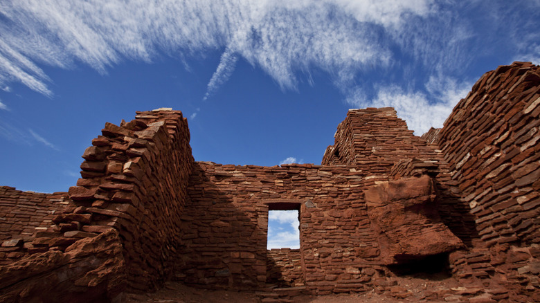 Towering Red Rock Ruins And Vast Desert Views Unveil An Archaeological ...
