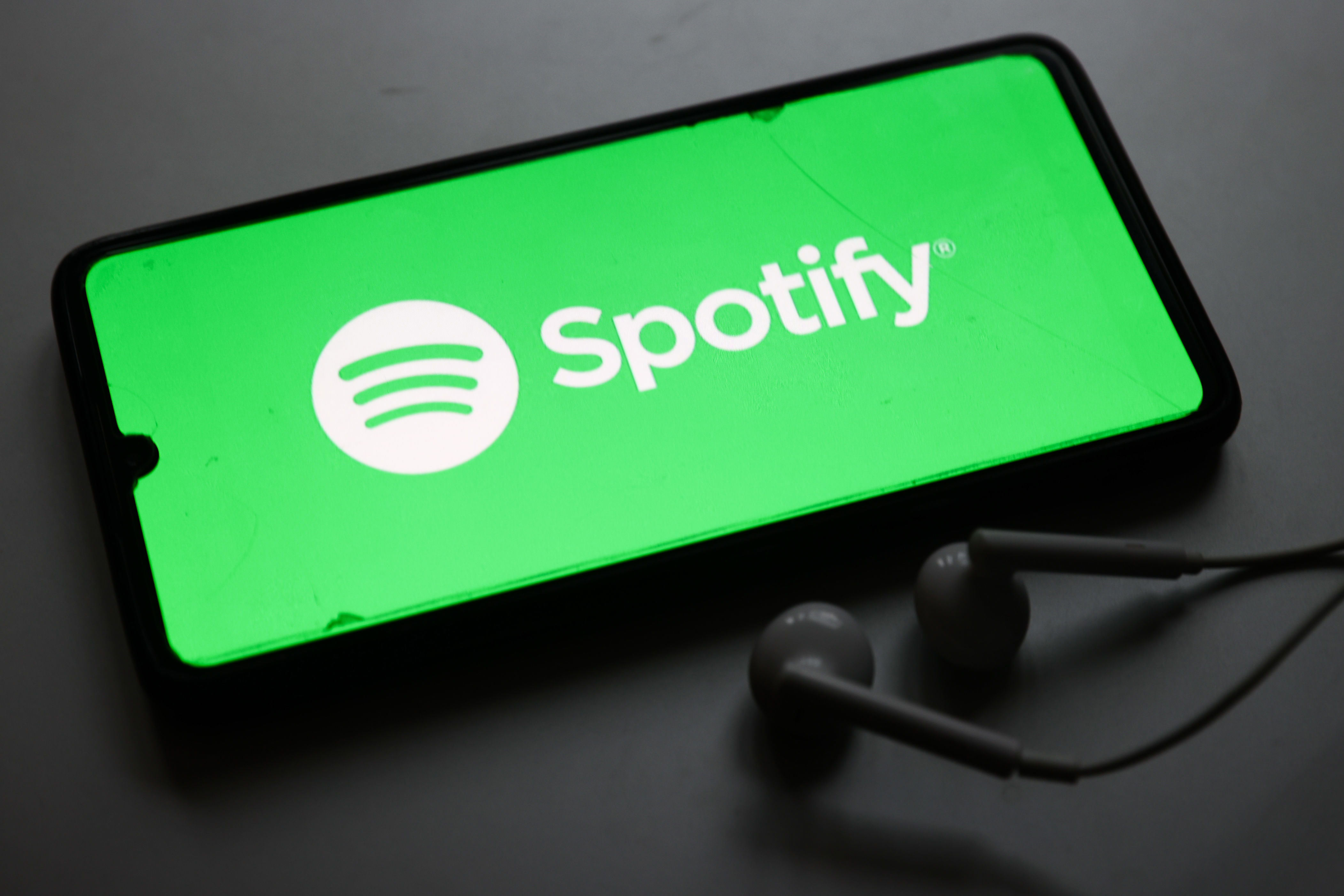 Spotify stock jumps after reporting its first full year of ...