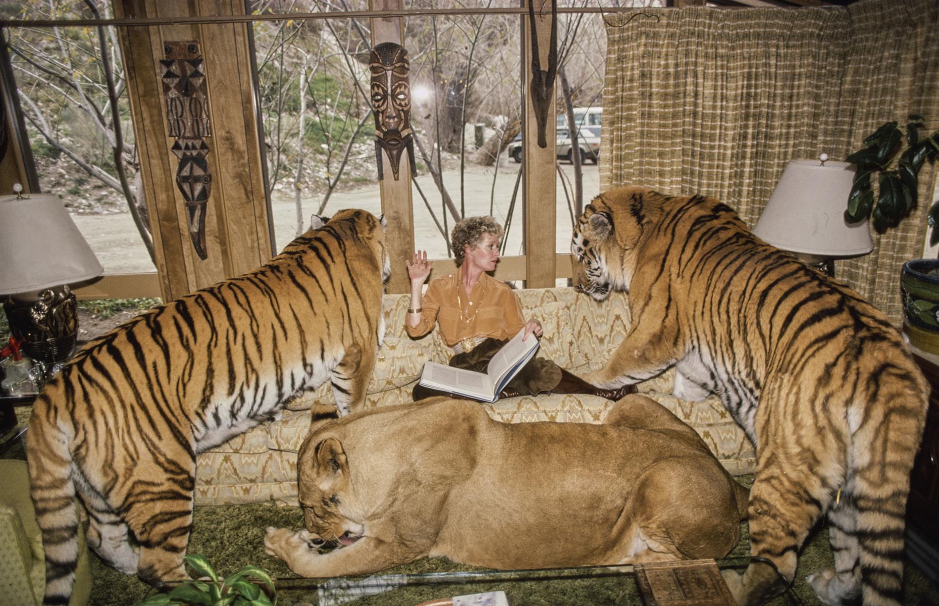 Iconic celebrities posing with their beloved pets at home