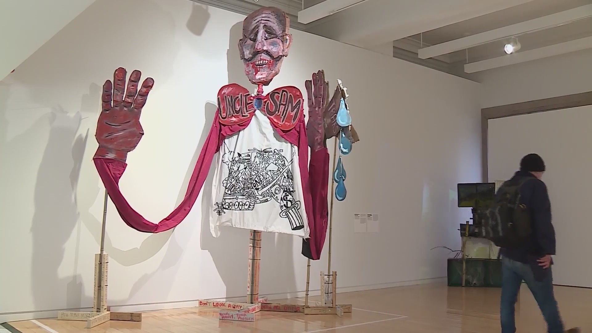 Hearing on controversial art devolves into shouting, name-calling — WGN ...